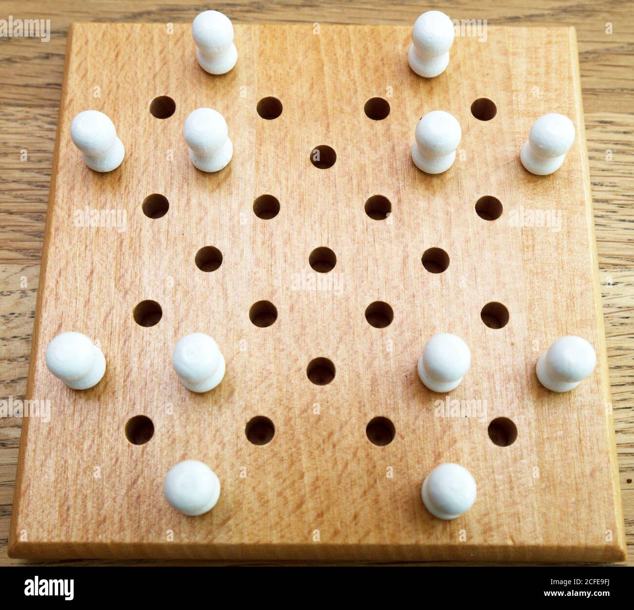 Solitaire game board with figures Stock Photo - Alamy