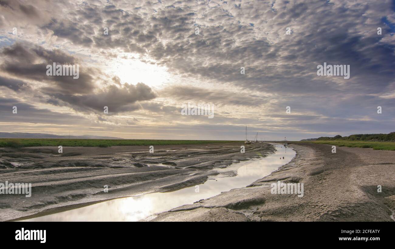 Beached boats waiting the tide on marshland at Lower Heswall boatyard ...