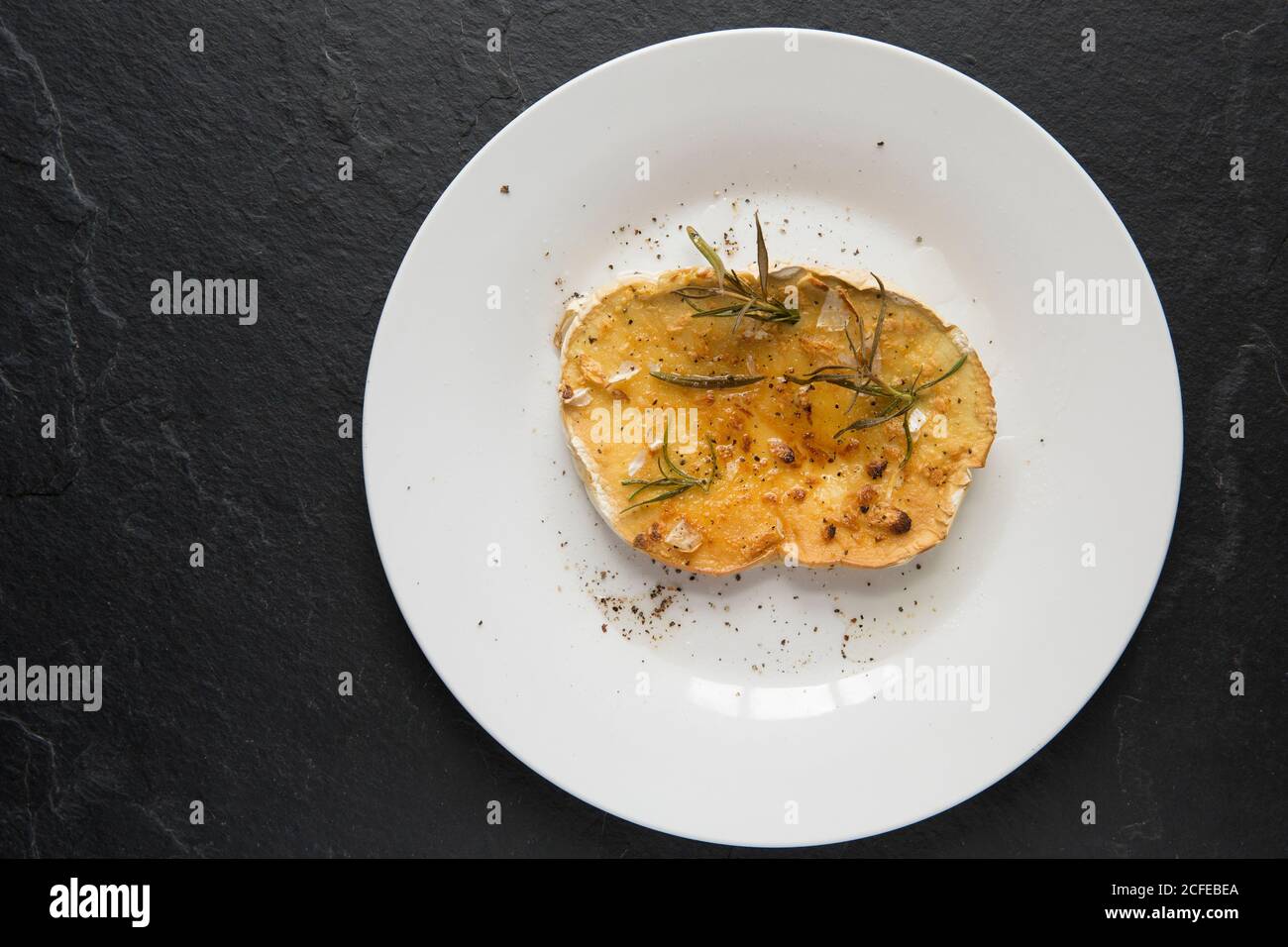 A slice of a giant puffball, Calvatia gigantea, that has been grilled ...