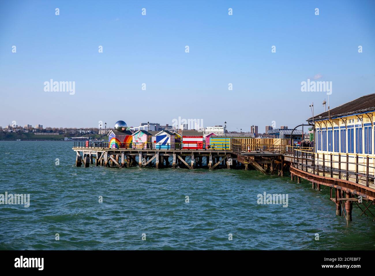 Brightly painted beach huts / sheds on Southend pier, Essex, UK Stock ...