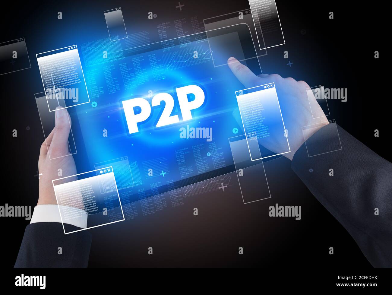 Close-up of a hand holding tablet with P2P abbreviation, modern ...