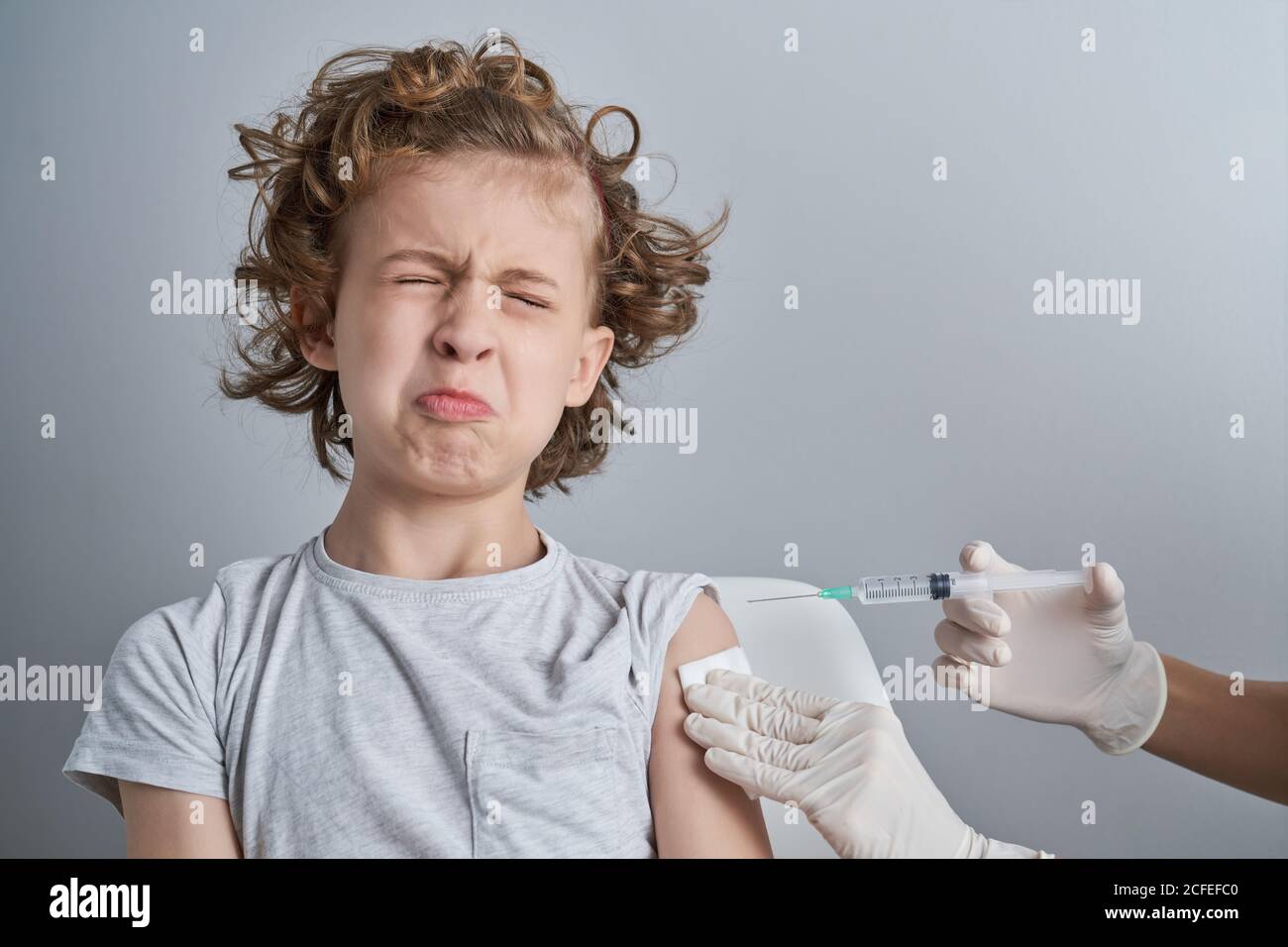 Nurse giving boy injection hi-res stock photography and images - Alamy