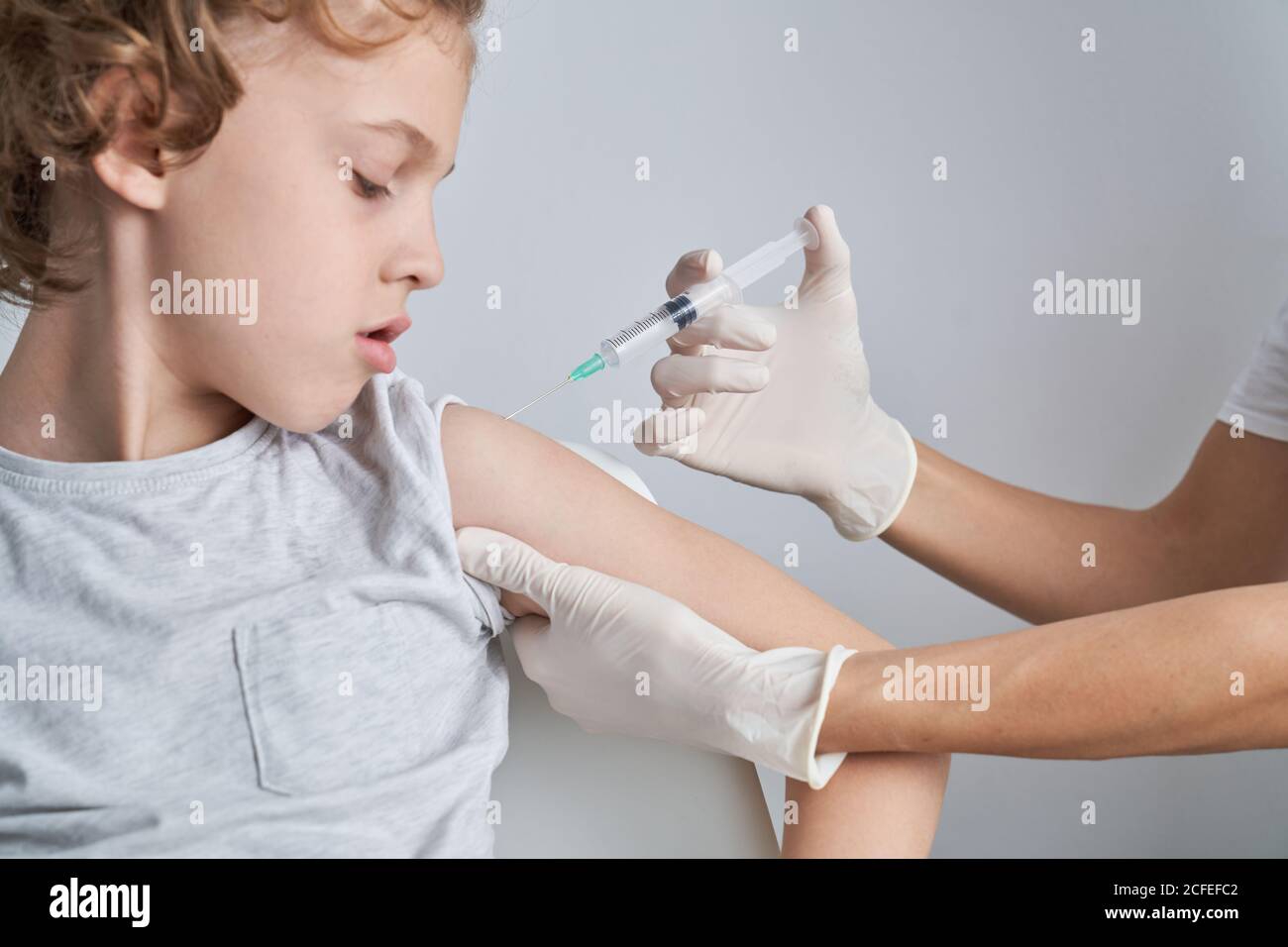 Nurse giving boy injection hi-res stock photography and images - Alamy
