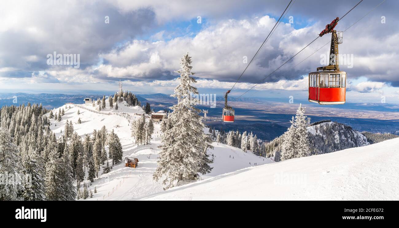 Landscape from top of Postavaru mountain with ski slopes and cable car ...