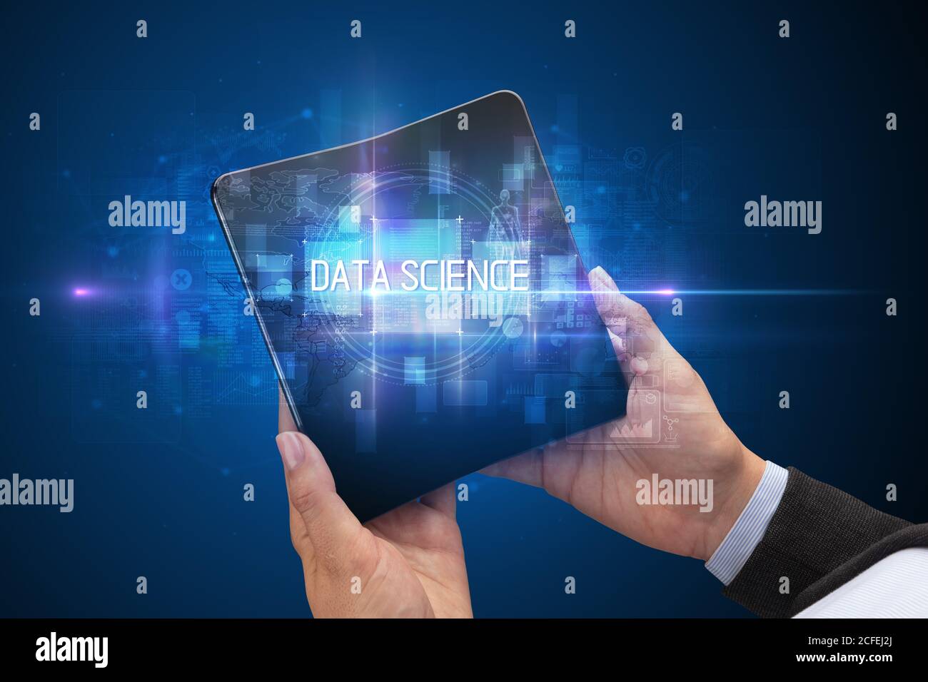 Businessman holding a foldable smartphone with DATA SCIENCE inscription ...