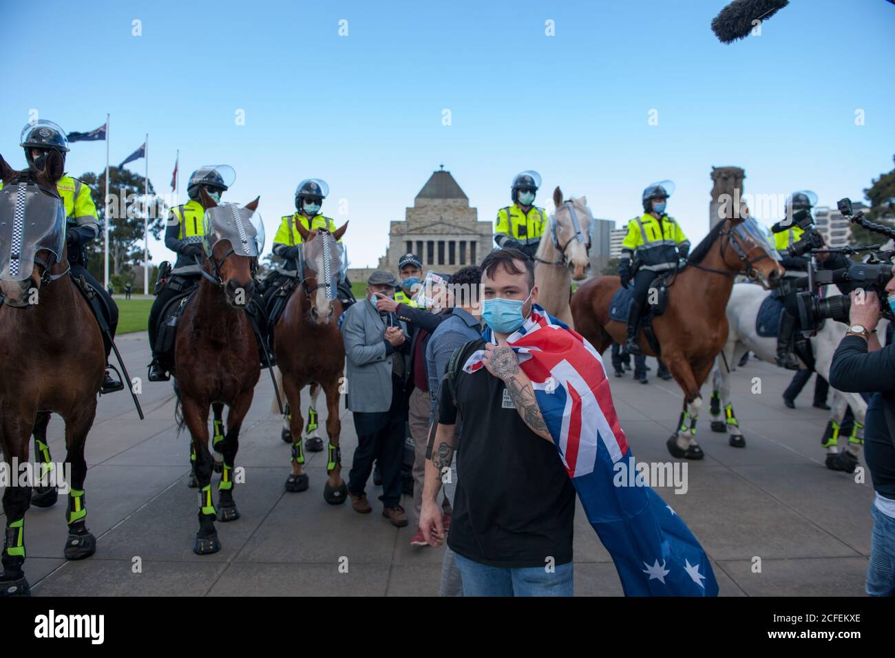Melbourne, Australia 5 Sep 2020, a protestor draped in an Australian ...