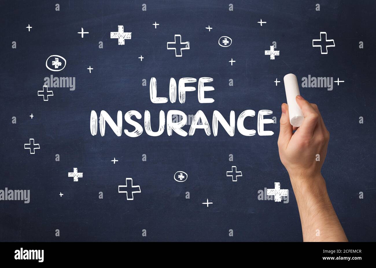 Hand drawing LIFE INSURANCE inscription with white chalk on blackboard ...