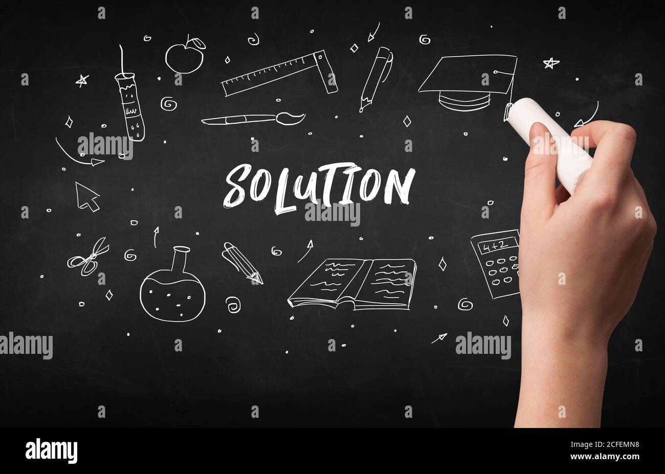 Hand drawing SOLUTION inscription with white chalk on blackboard ...