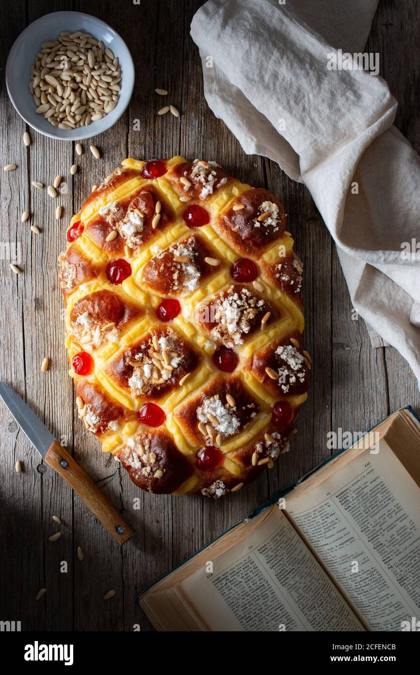 Top view of fresh Coca de San Juan pastry with seeds and open recipe ...