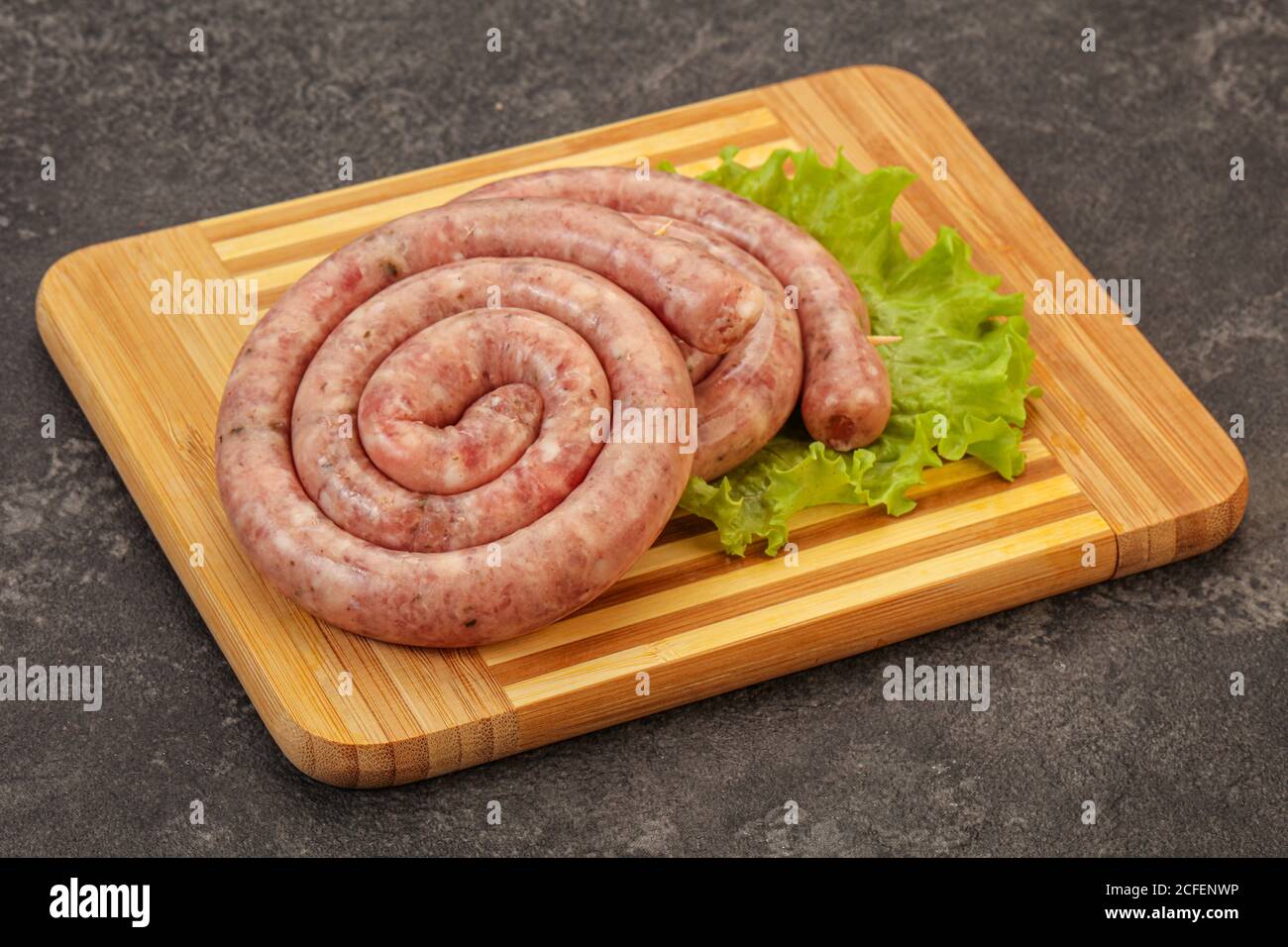 Raw pork sausage ring for grill Stock Photo - Alamy
