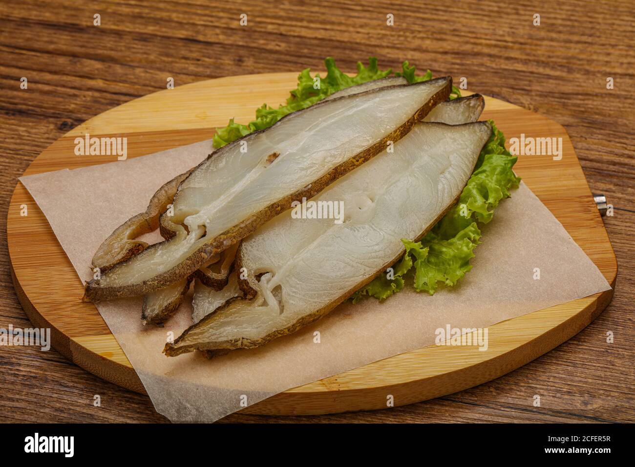 Delicous smoked halibut fish slices snack Stock Photo - Alamy