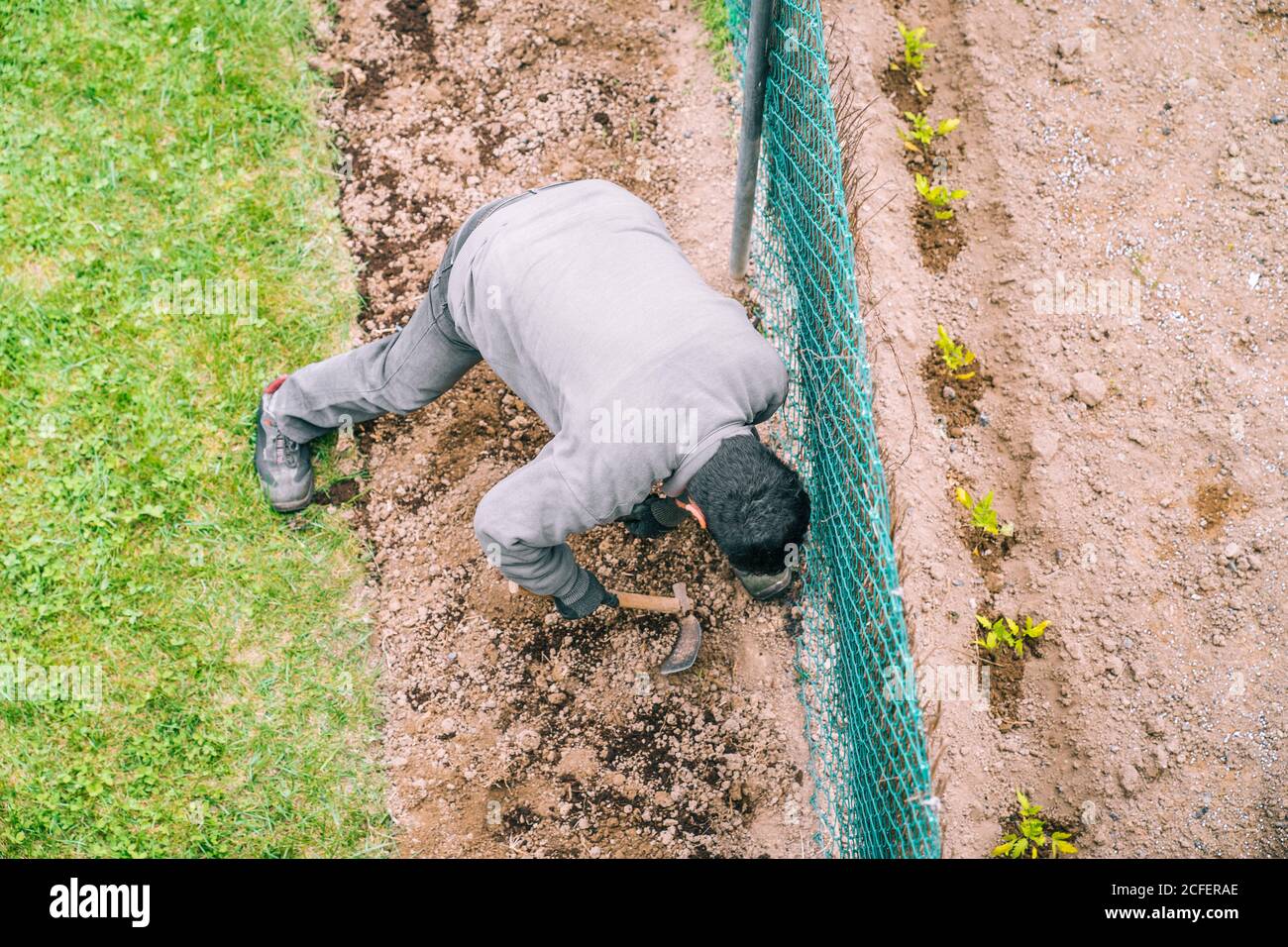Man with rake hi-res stock photography and images - Alamy