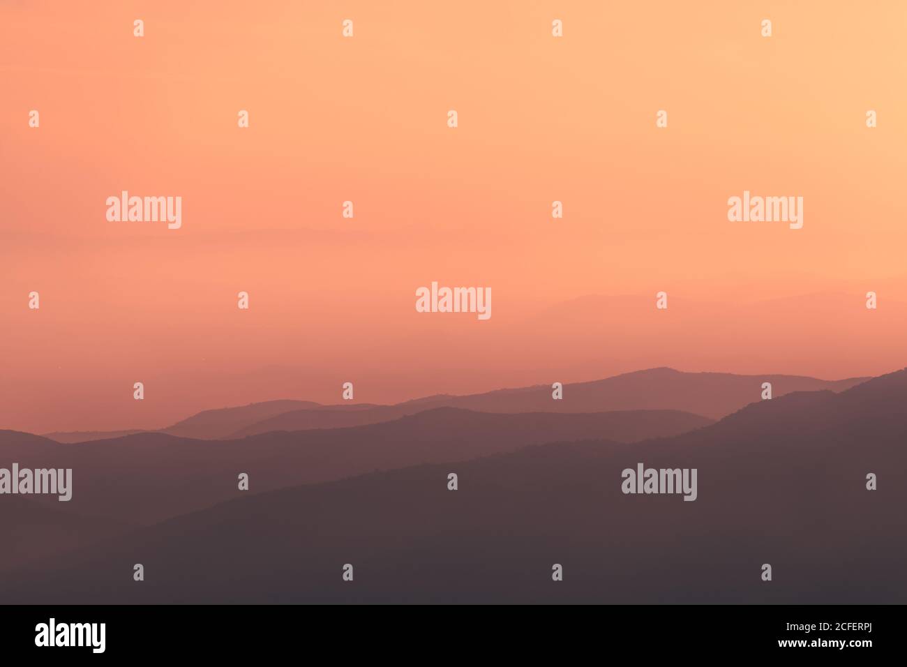 Sunset sky over mountain ridge Stock Photo - Alamy