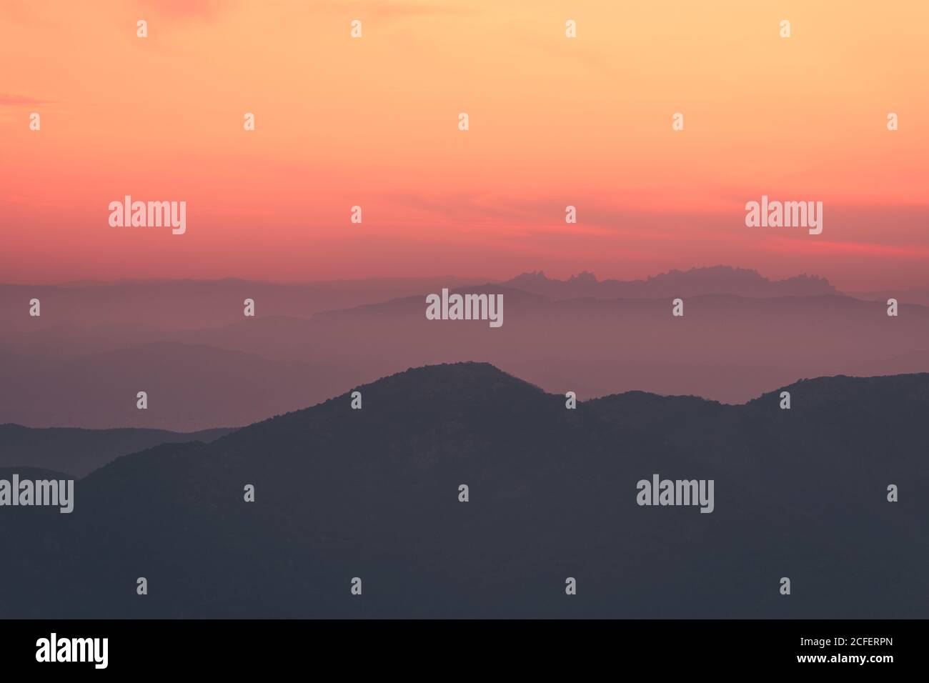 Sunset sky over mountain ridge Stock Photo - Alamy