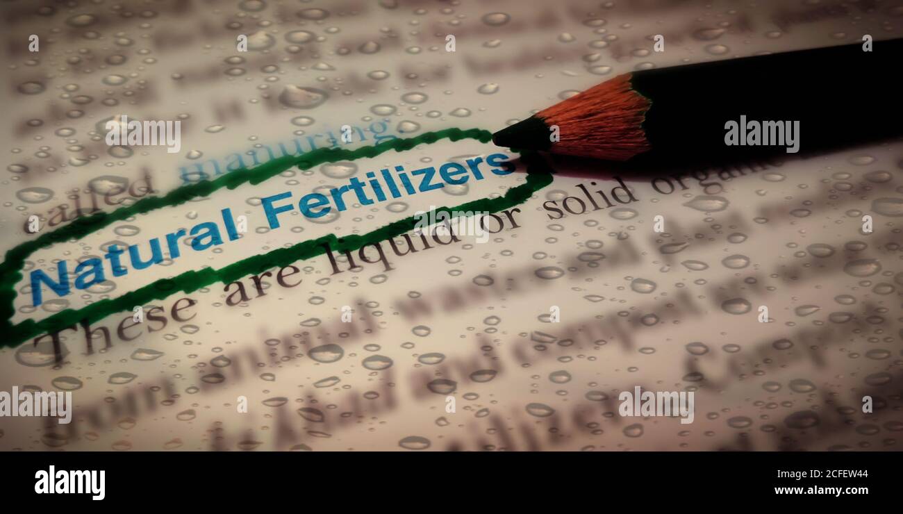 Natural Fertilizer word highlighted with closeup view on book word ...