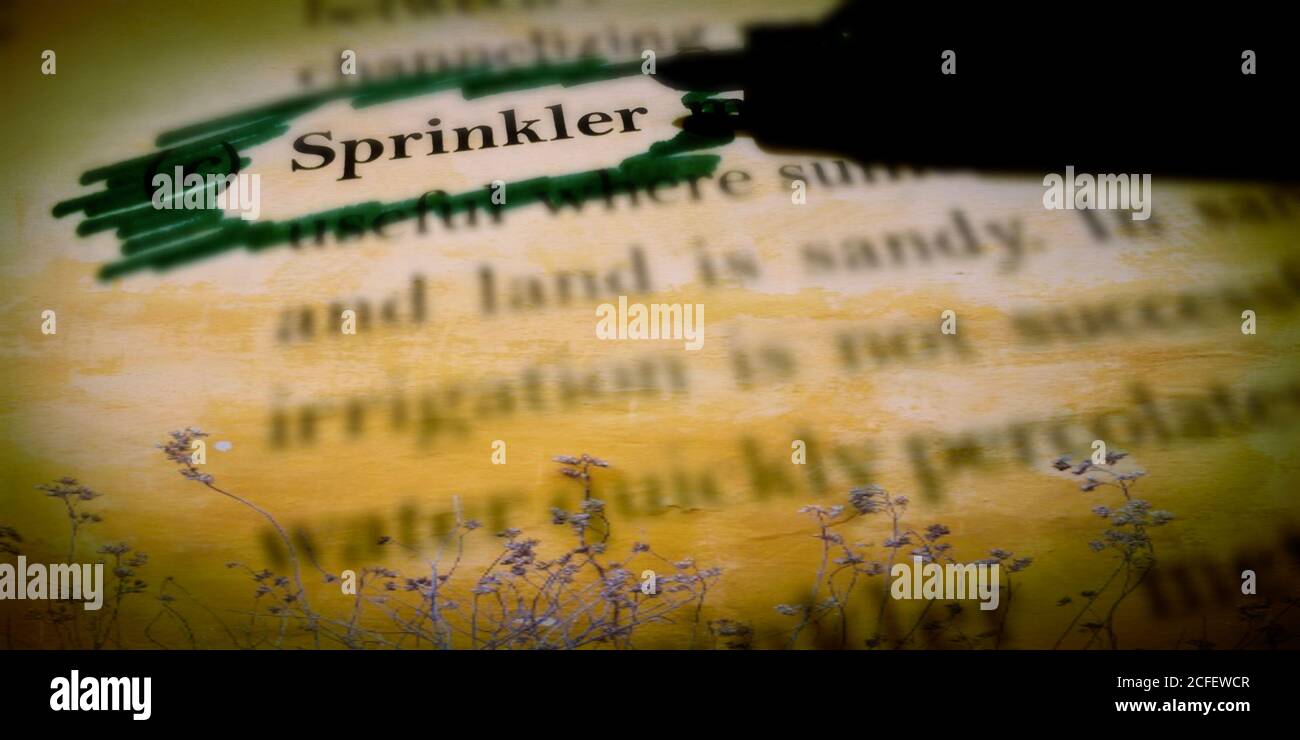 Sprinkler word highlighted with closeup view on book word educational ...