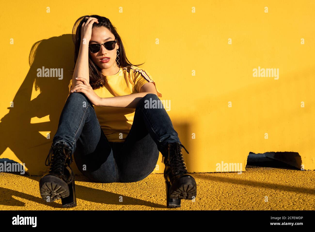 Calm young Woman enjoying sunlight on stadium Stock Photo - Alamy