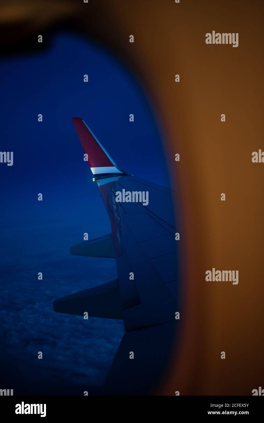 Airplane flying in dark clouds hi-res stock photography and images - Alamy