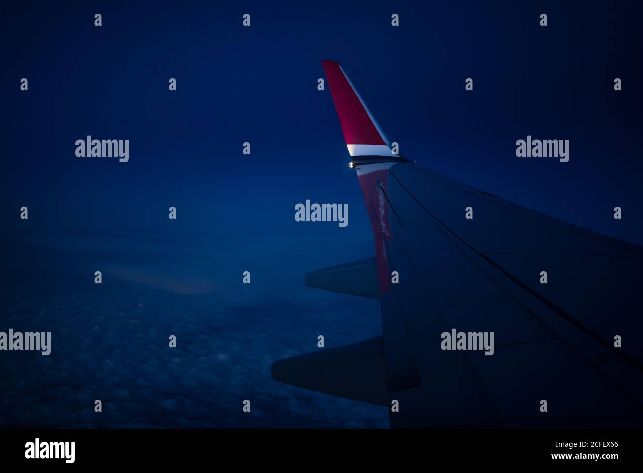 Airplane flying in dark clouds hi-res stock photography and images - Alamy