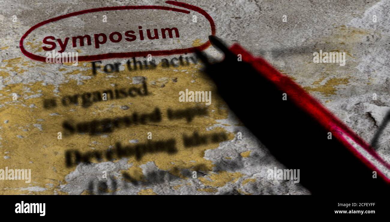 Symposium word highlighted with closeup view on book word educational ...