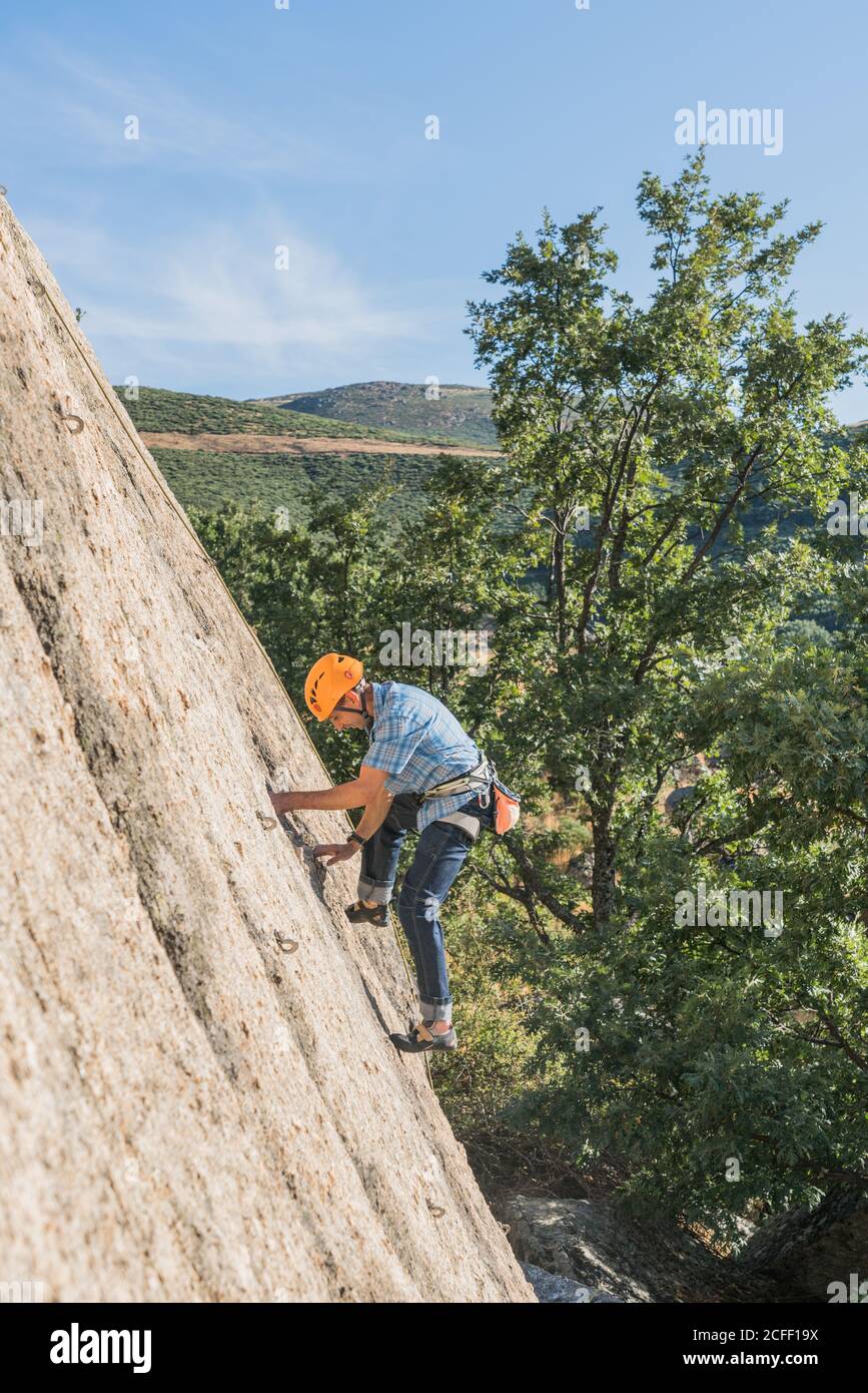 Top view of free climber climbing in nature Stock Photo - Alamy