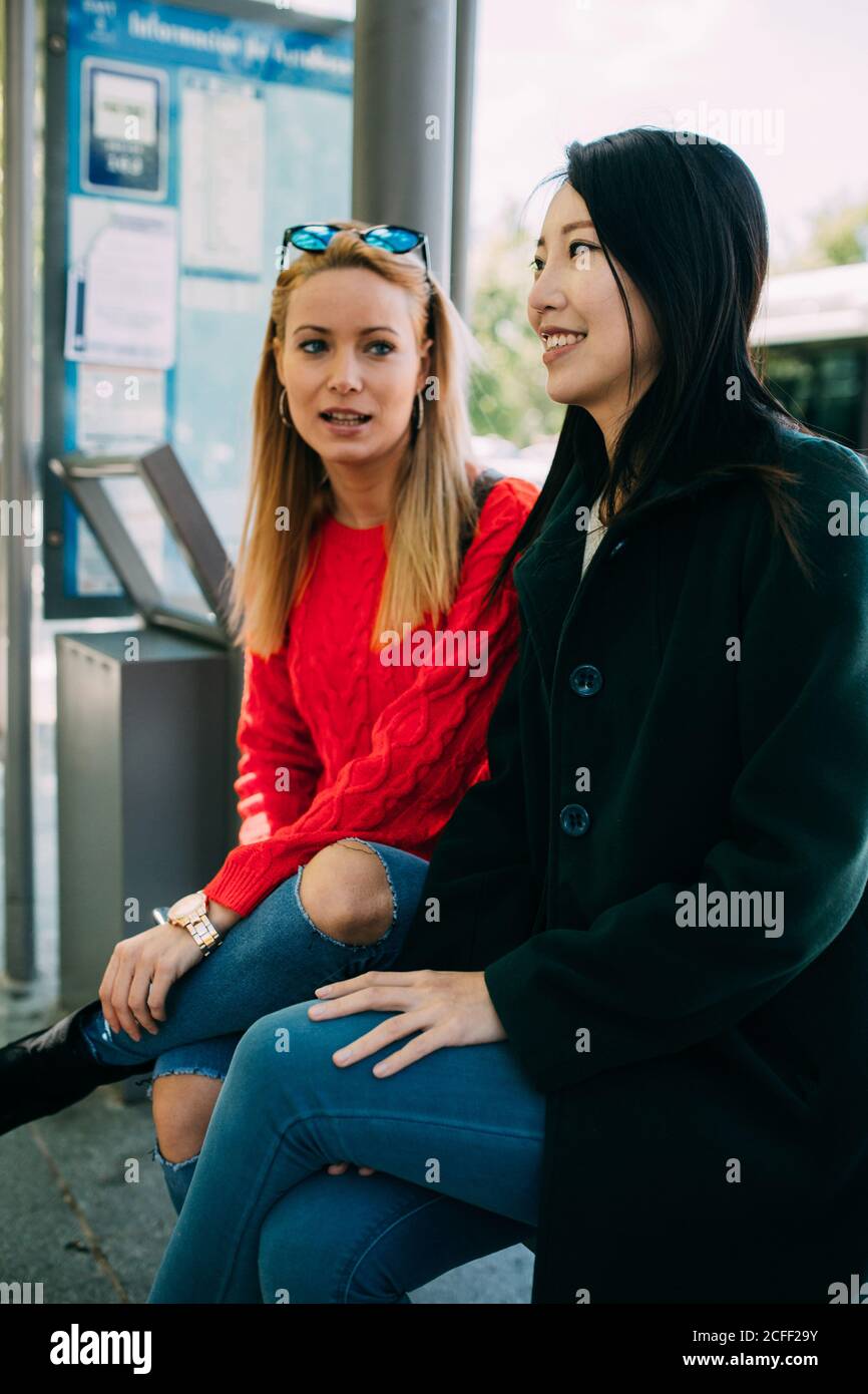 Sitting on bus stop bench hi-res stock photography and images - Alamy