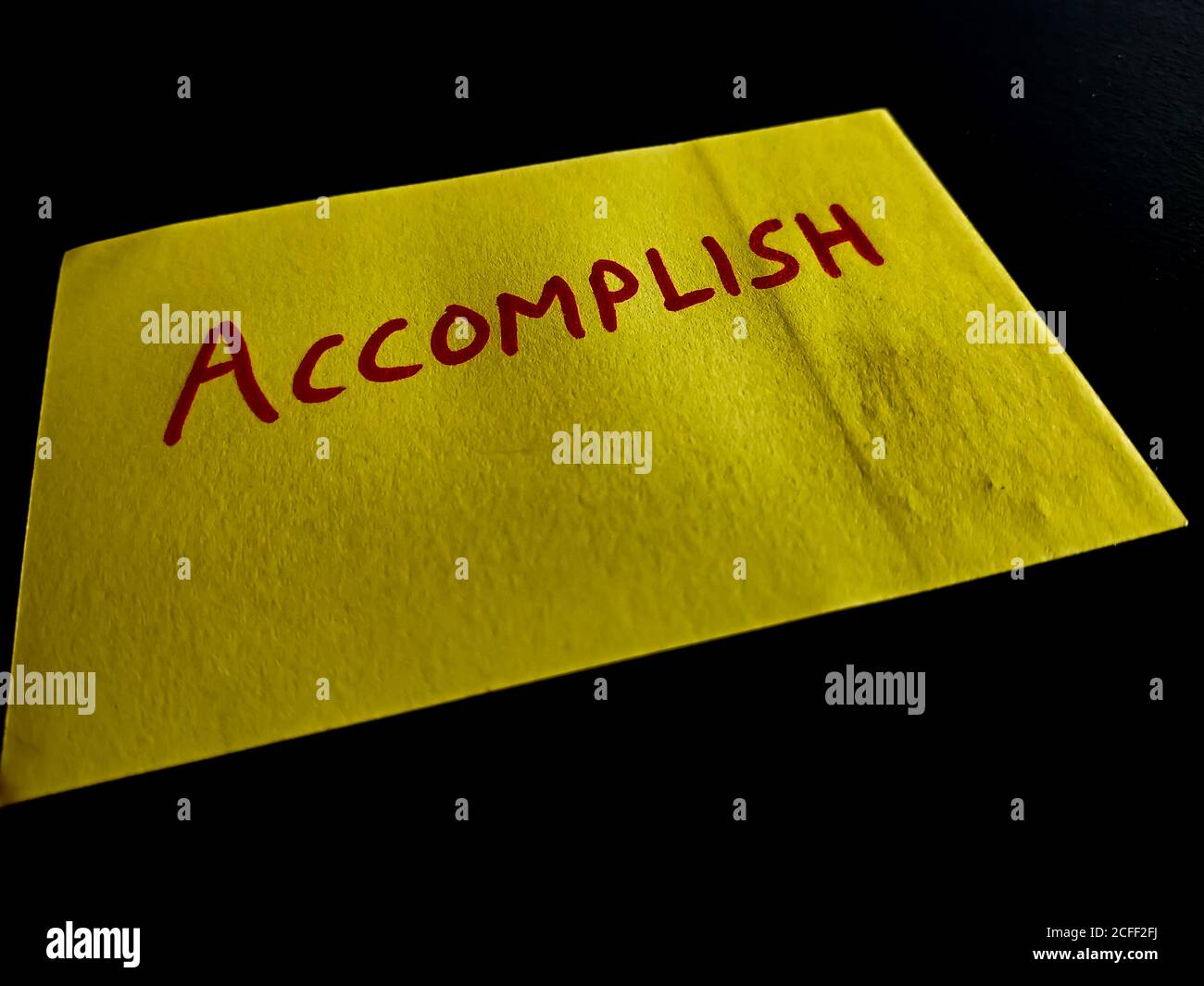 Accomplish word displayed on paper slip concept for educational ...