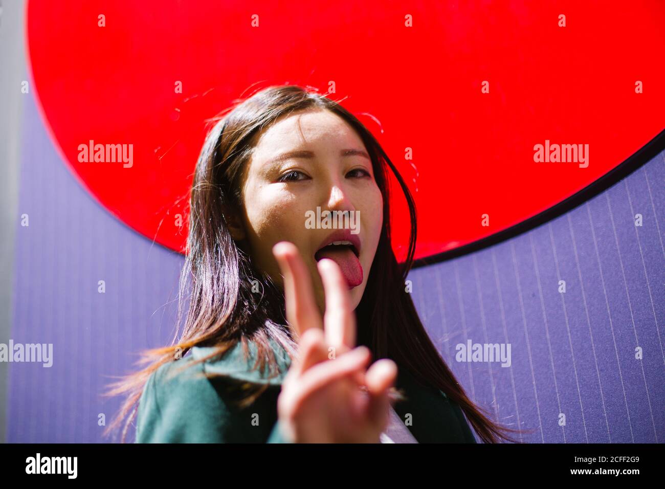 V sign tongue hi-res stock photography and images - Alamy