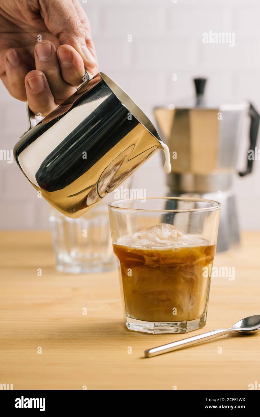 Milk pouring into pitcher hi-res stock photography and images - Alamy