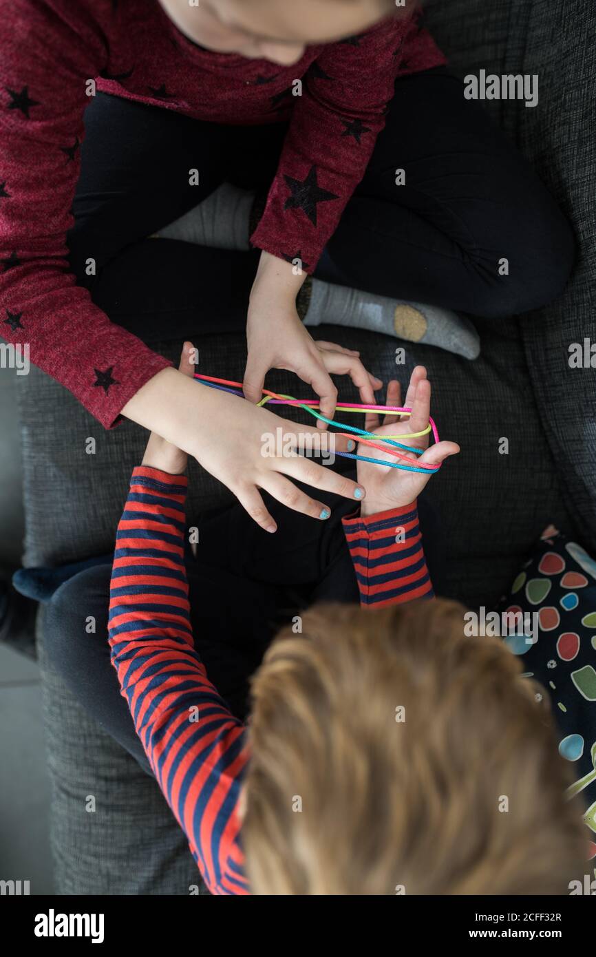 Smart children using rubber bands for game Stock Photo - Alamy
