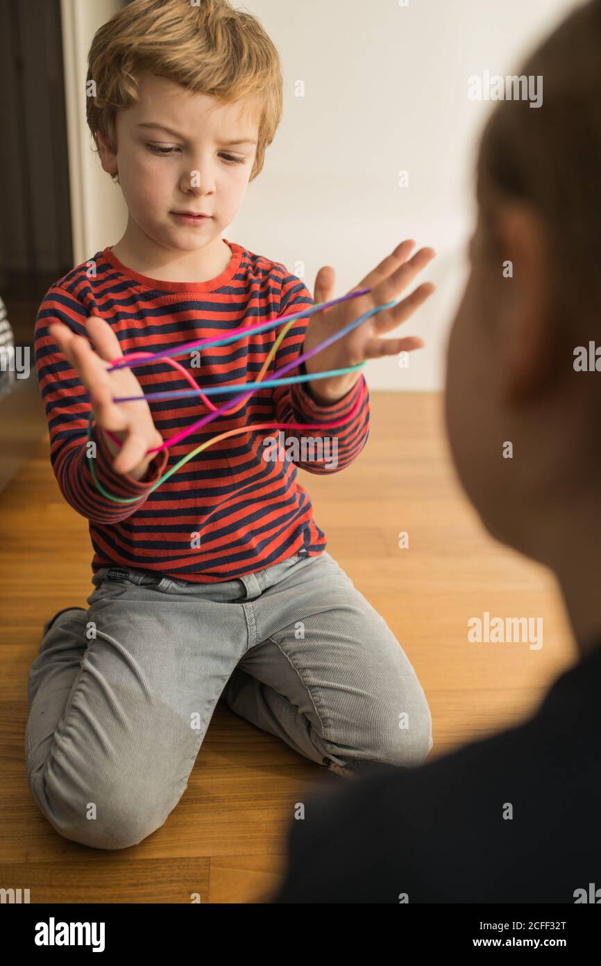 Smart children using rubber bands for game Stock Photo - Alamy