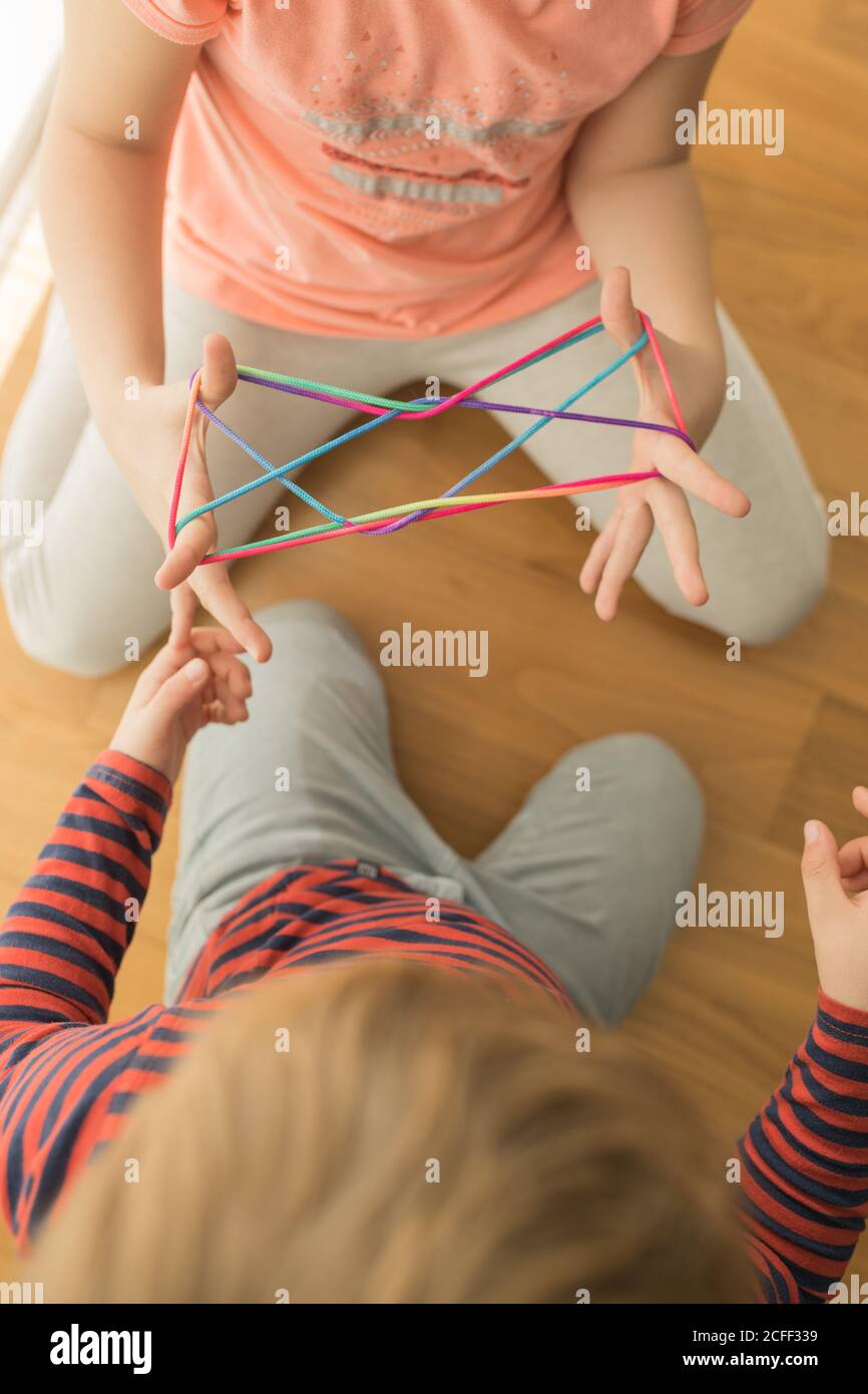 Smart children using rubber bands for game Stock Photo - Alamy