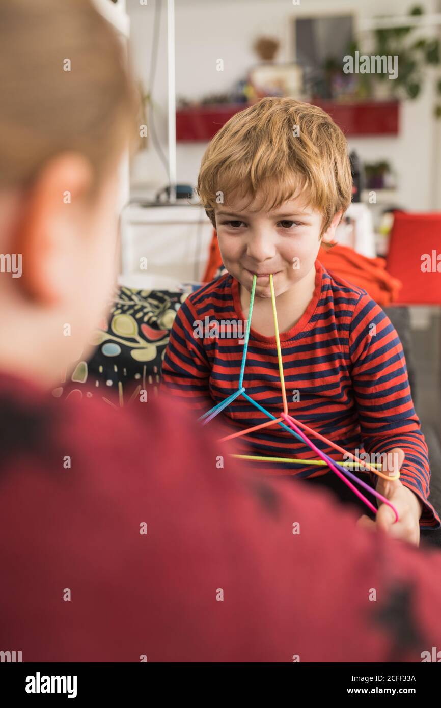 Smart children using rubber bands for game Stock Photo - Alamy
