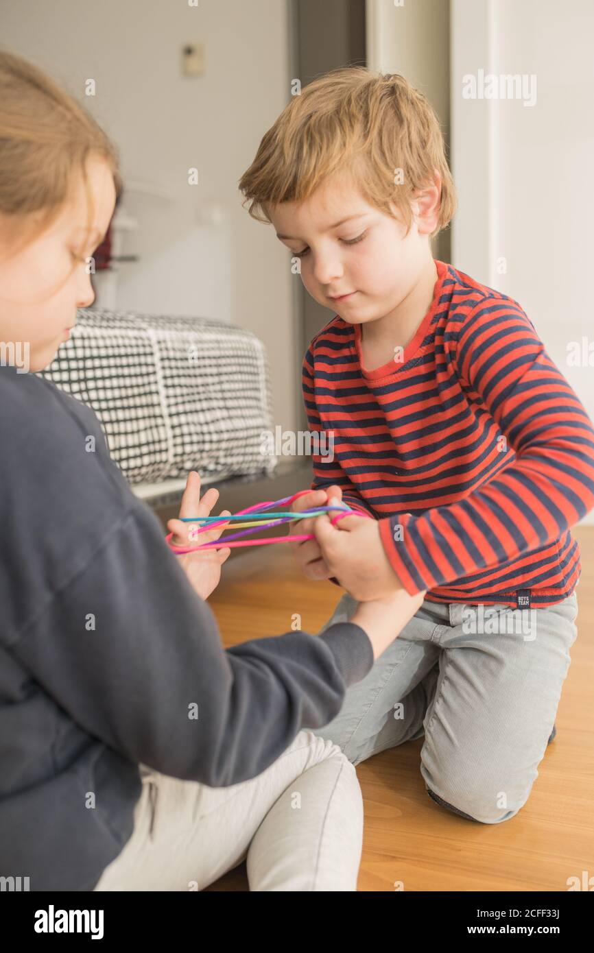Smart children using rubber bands for game Stock Photo - Alamy