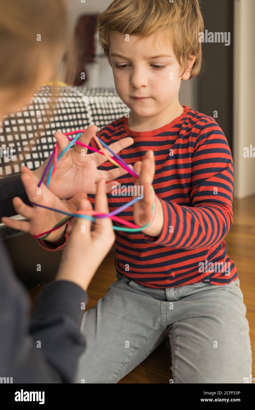 Smart children using rubber bands for game Stock Photo - Alamy
