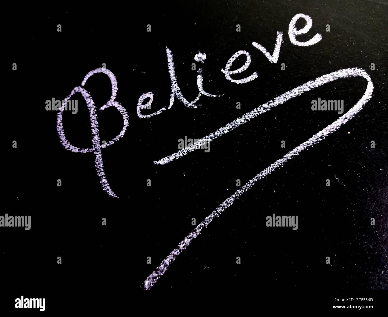 Believe word displayed on chalkboard for learning and awareness ...