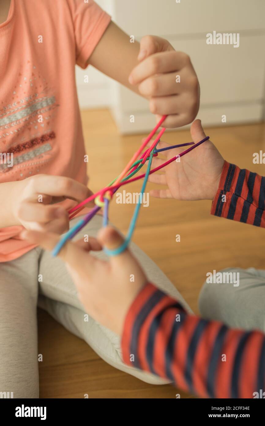 Smart children using rubber bands for game Stock Photo - Alamy