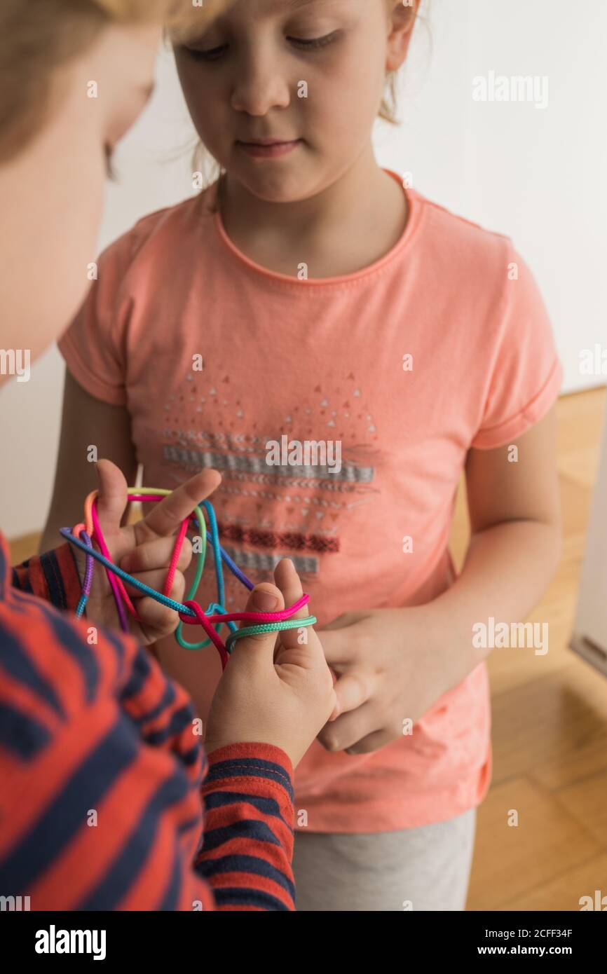 Smart children using rubber bands for game Stock Photo - Alamy