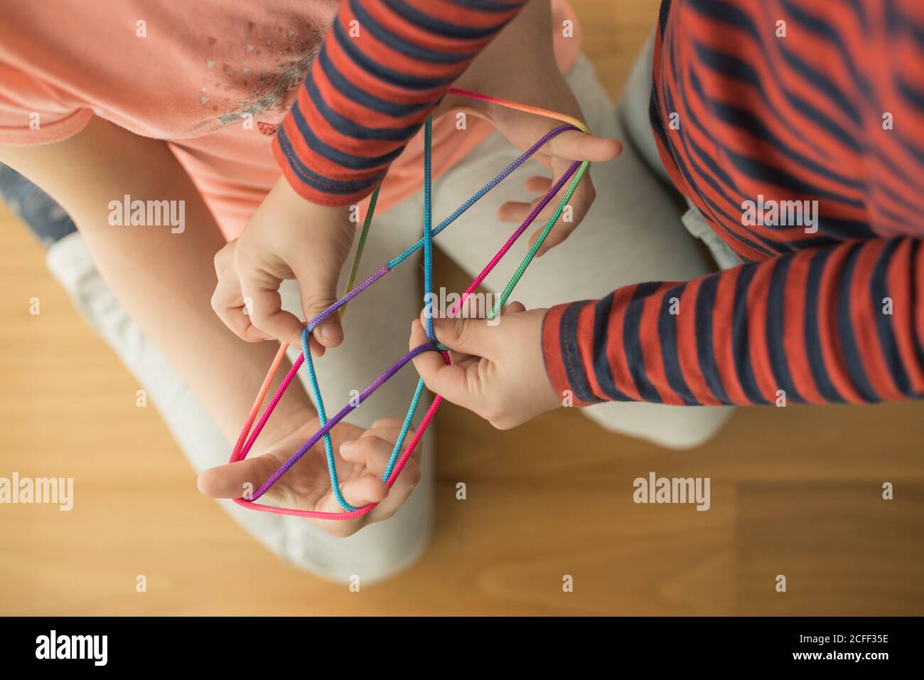 Smart children using rubber bands for game Stock Photo - Alamy