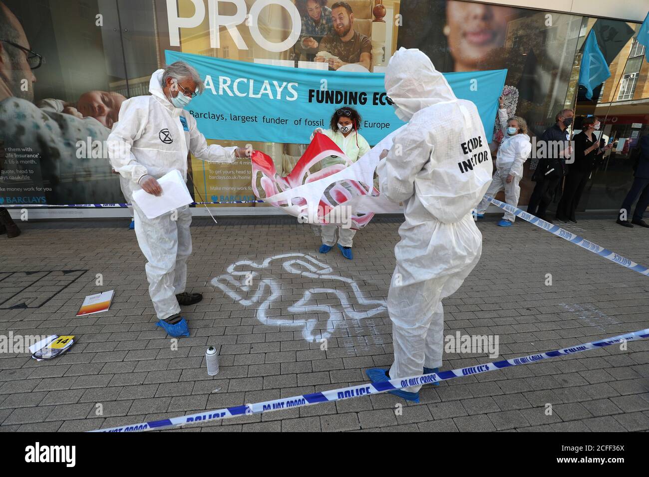 Protesters dressed as forensic investigators outside Barclays bank in ...