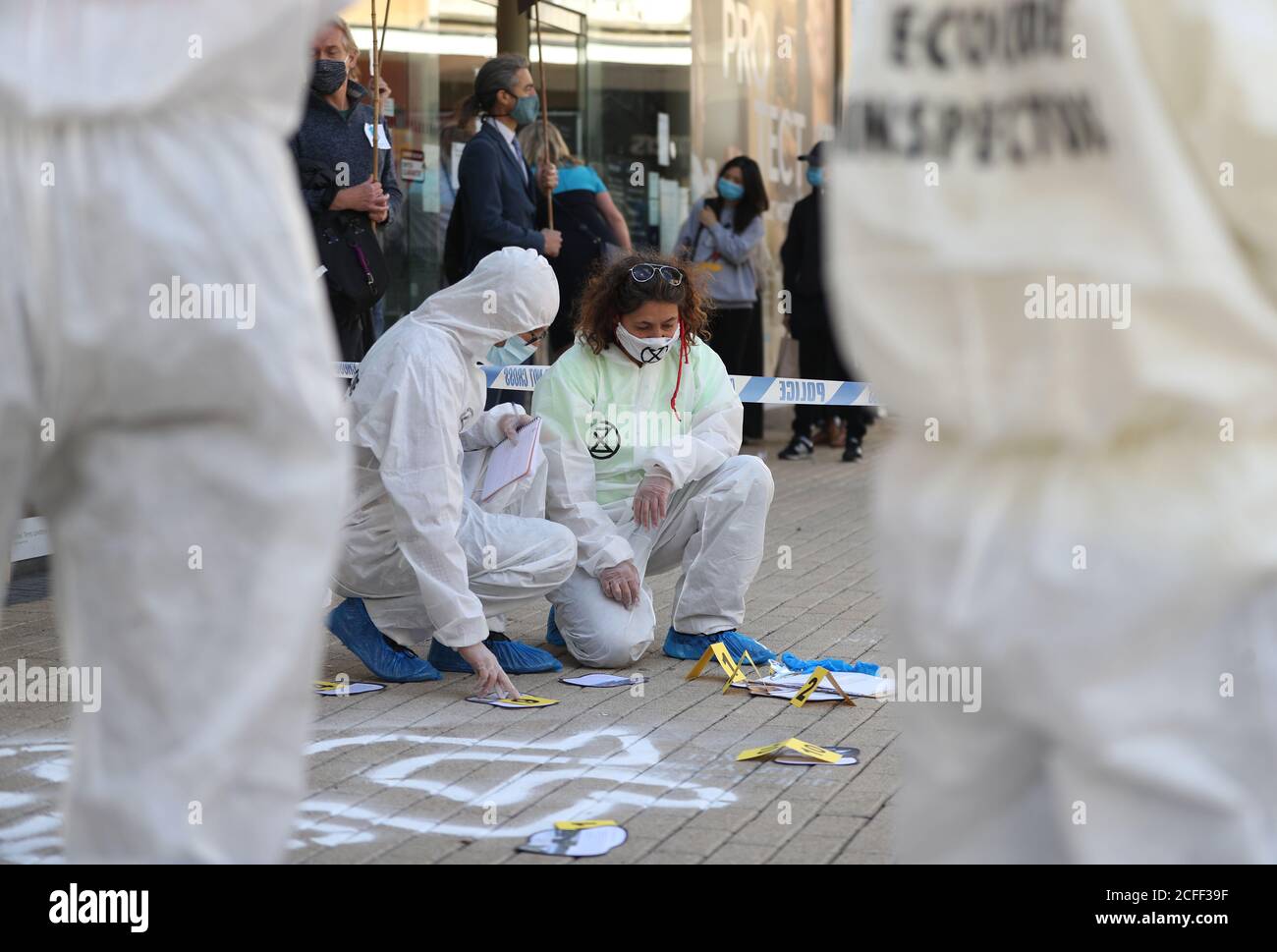 Protesters dressed as forensic investigators outside Barclays bank in ...