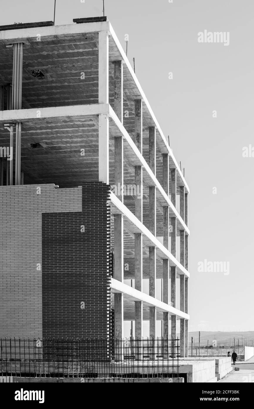 Unfinished construction site with erected concrete frame of building ...
