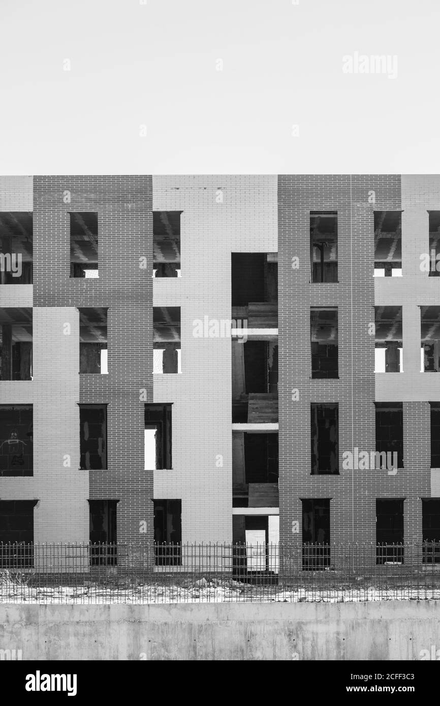 Unfinished construction site with erected concrete frame of building ...