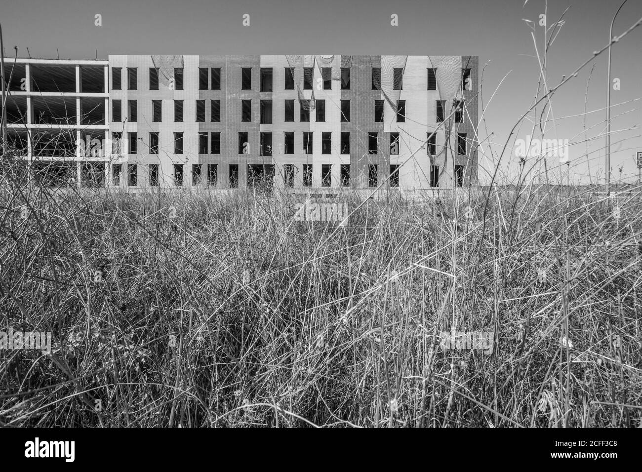 Unfinished construction site with erected concrete frame of building ...