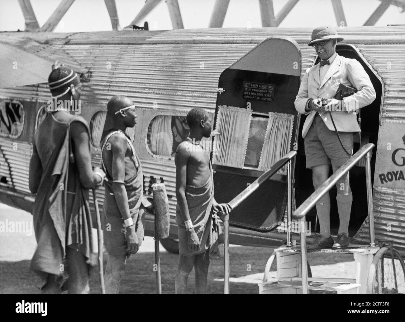 Original Caption: Sudan. Malakal. Passengers alighting from plane ...