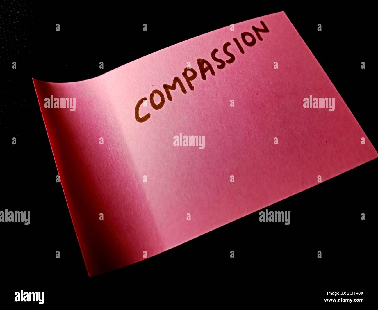 Compassion word displayed on paper slip concept for educational ...