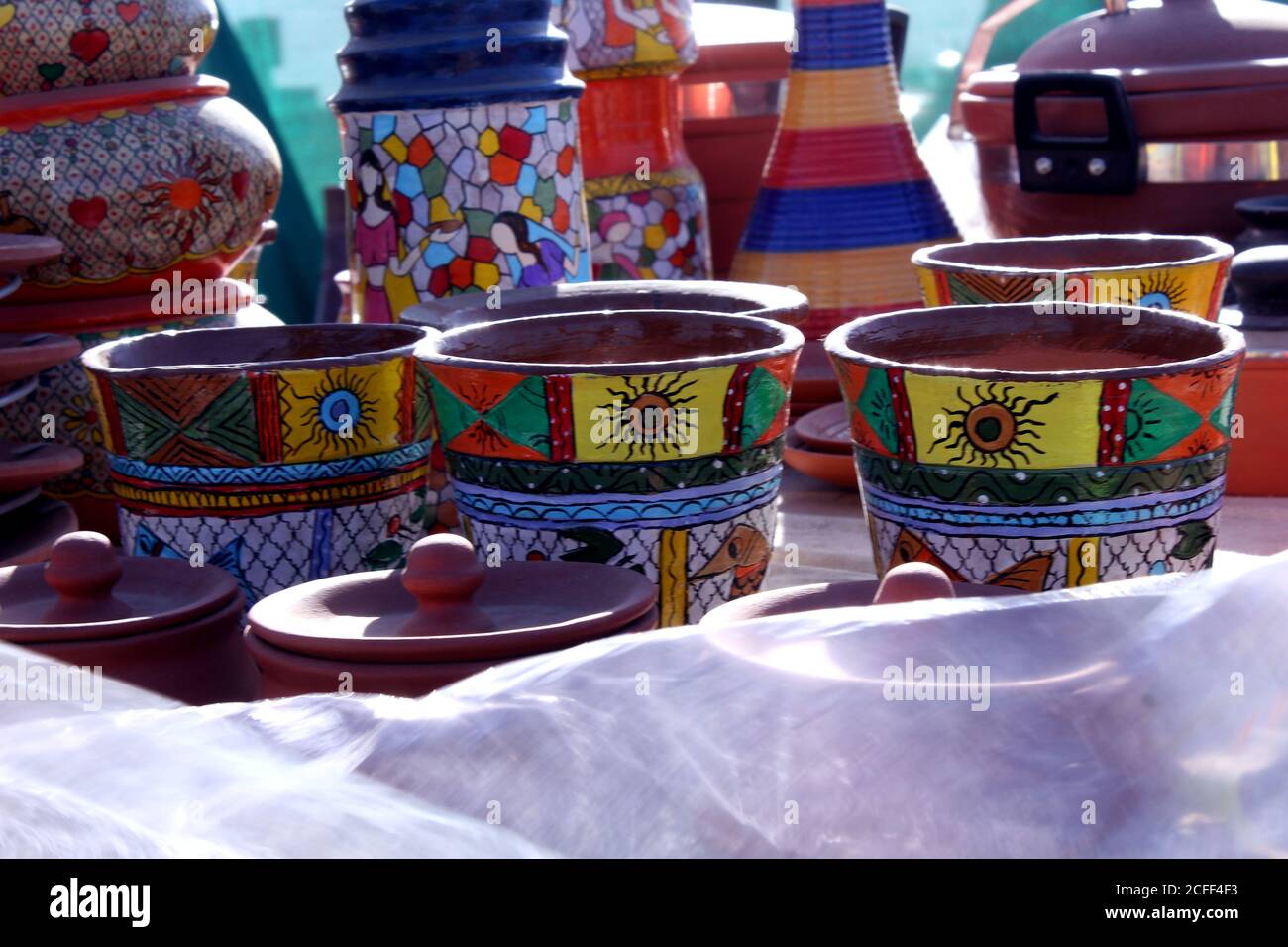 colorful crockery vase, handcrafted traditional clay pot in market ...