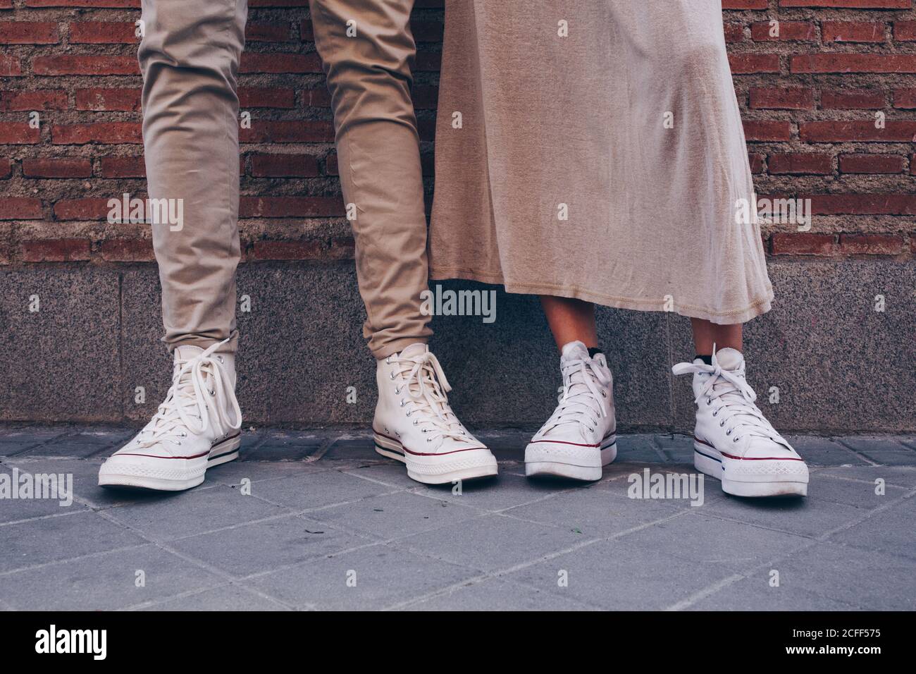 Crop view of anonymous couple feet standing in street next to each ...