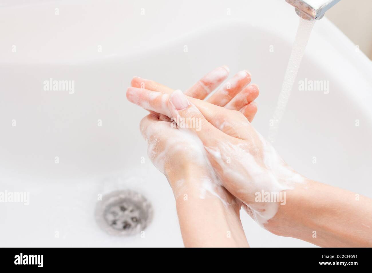Person washing hi-res stock photography and images - Alamy