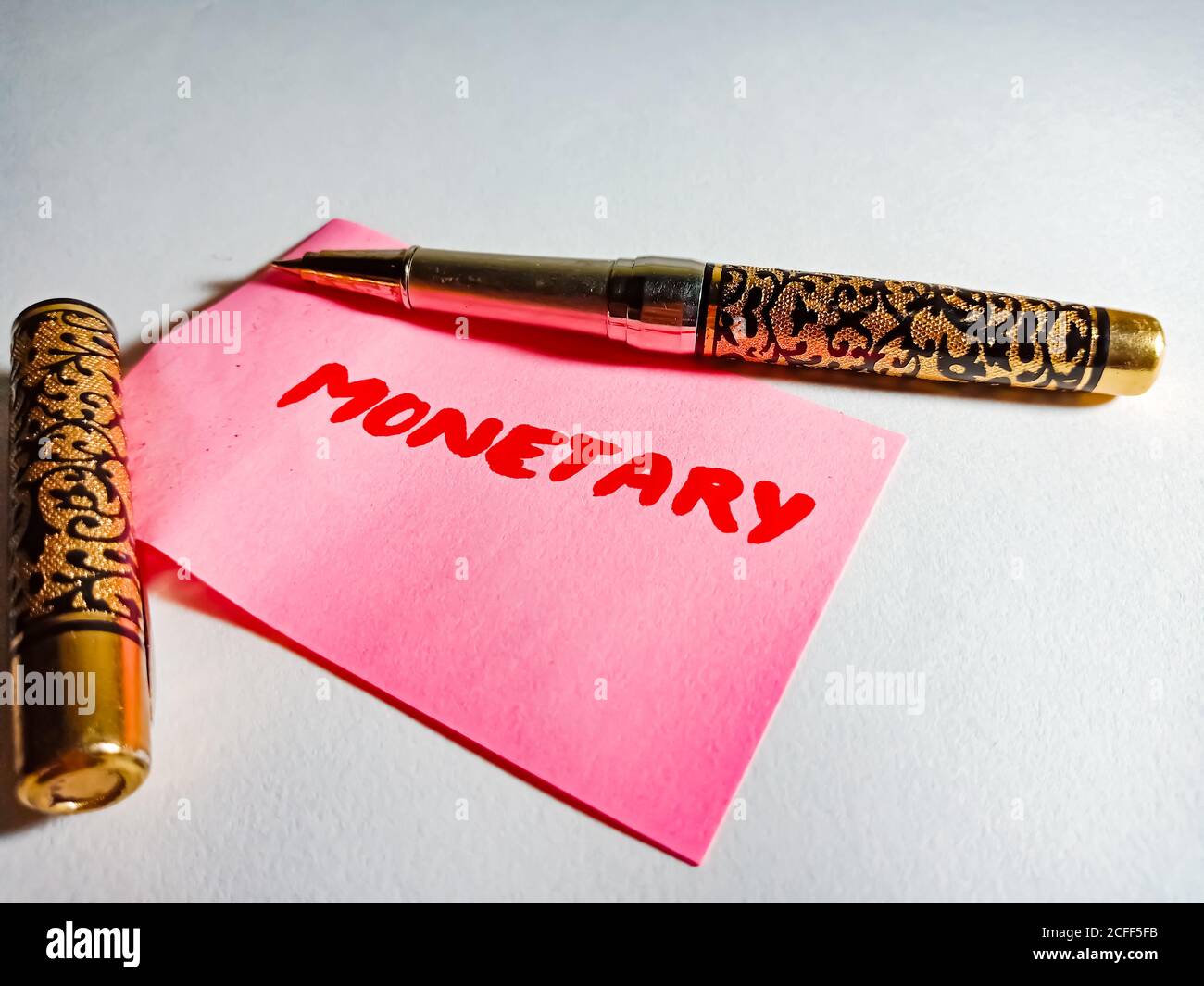 Monetary word displayed on paper slip concept for educational ...